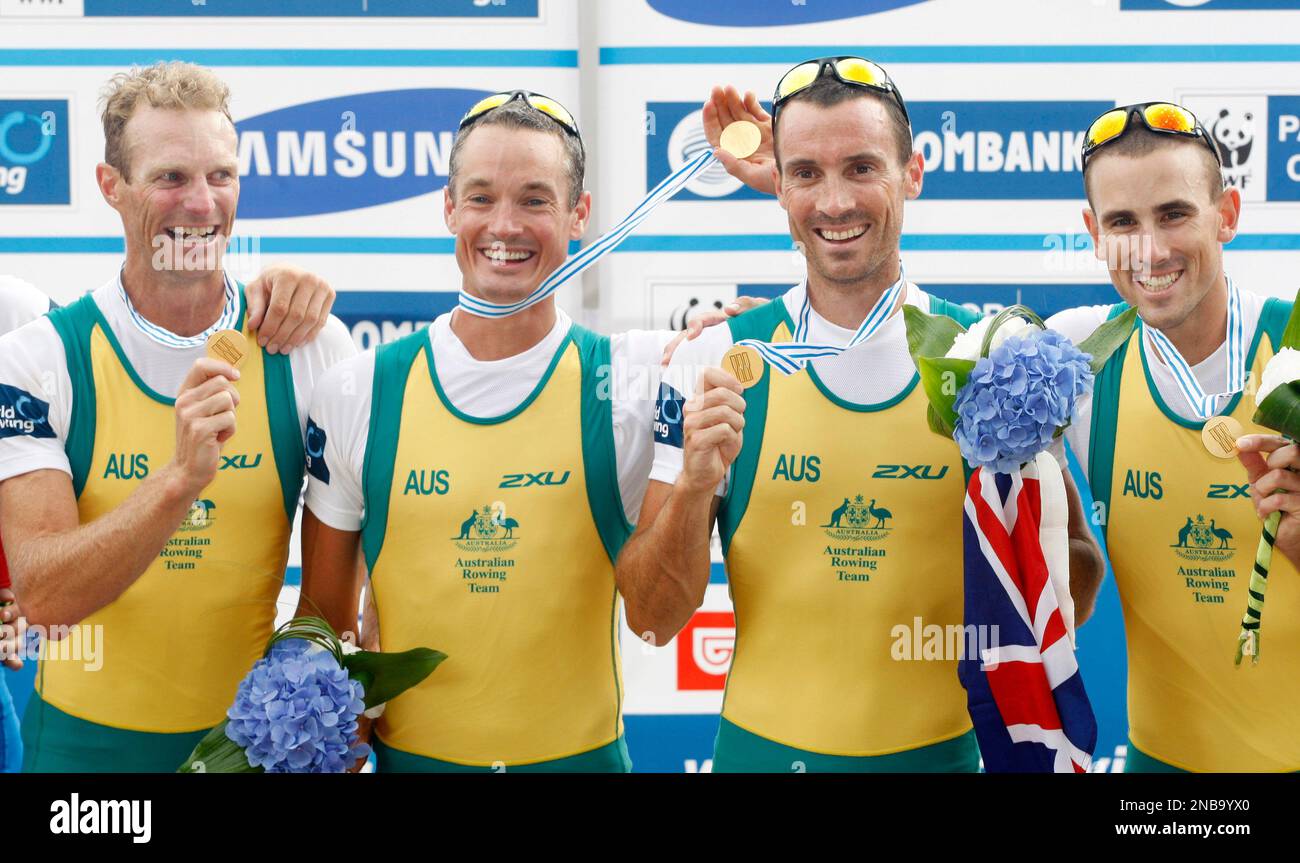 Team of Australia display their gold medals on the podium after winning ...