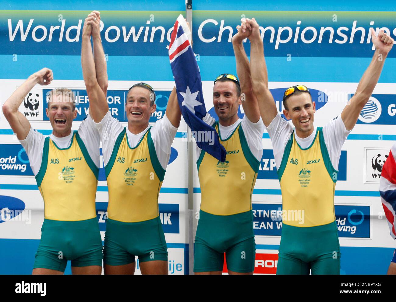 Team of Australia celebrates on the podium after winning the ...