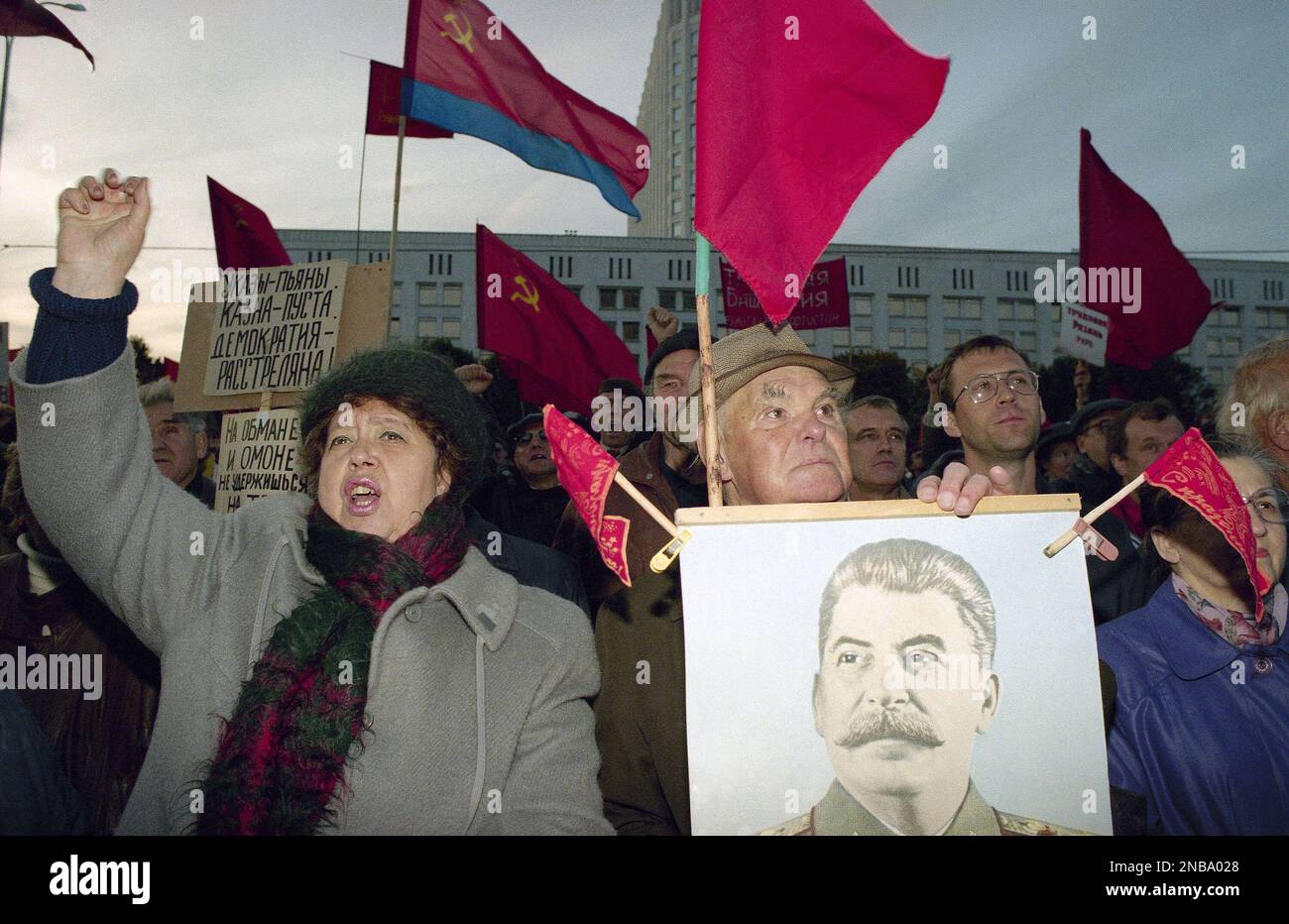 Communist hard-liners, carrying Soviet flags and portraits of Communist ...
