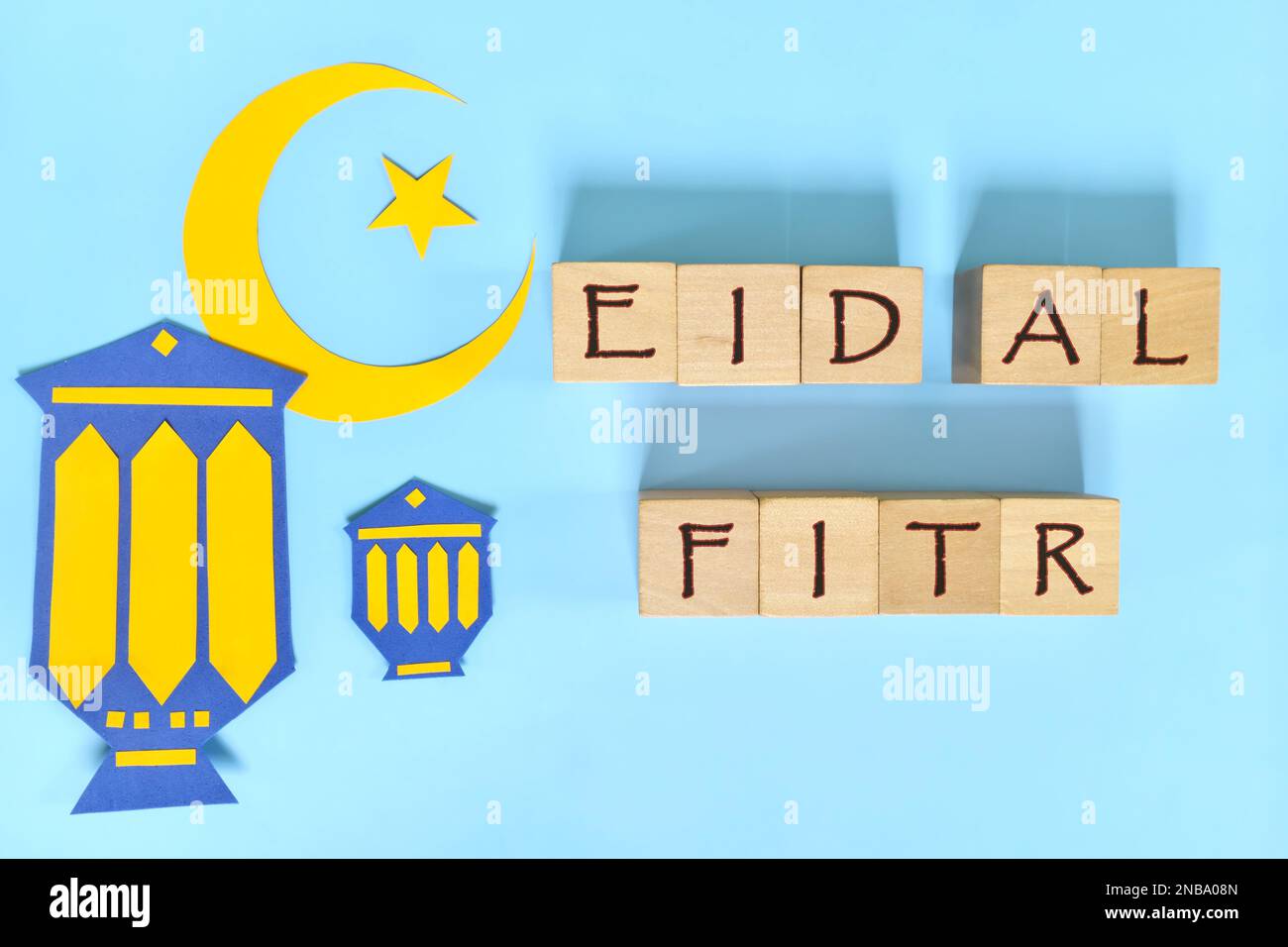 Crescent moon, star and lantern decoration with text on wooden blocks ...