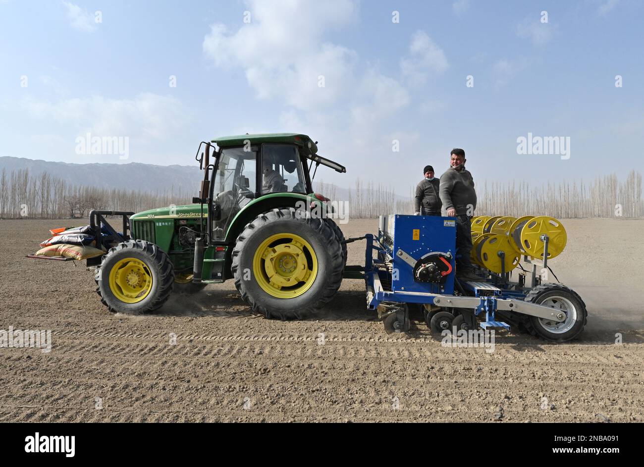 BAZHOU, CHINA - FEBRUARY 13, 2023 - A farmer sows spring wheat in ...