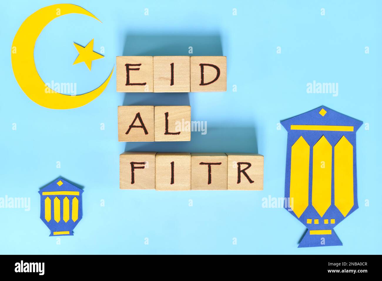 Crescent moon, star and lantern decoration with text on wooden blocks ...