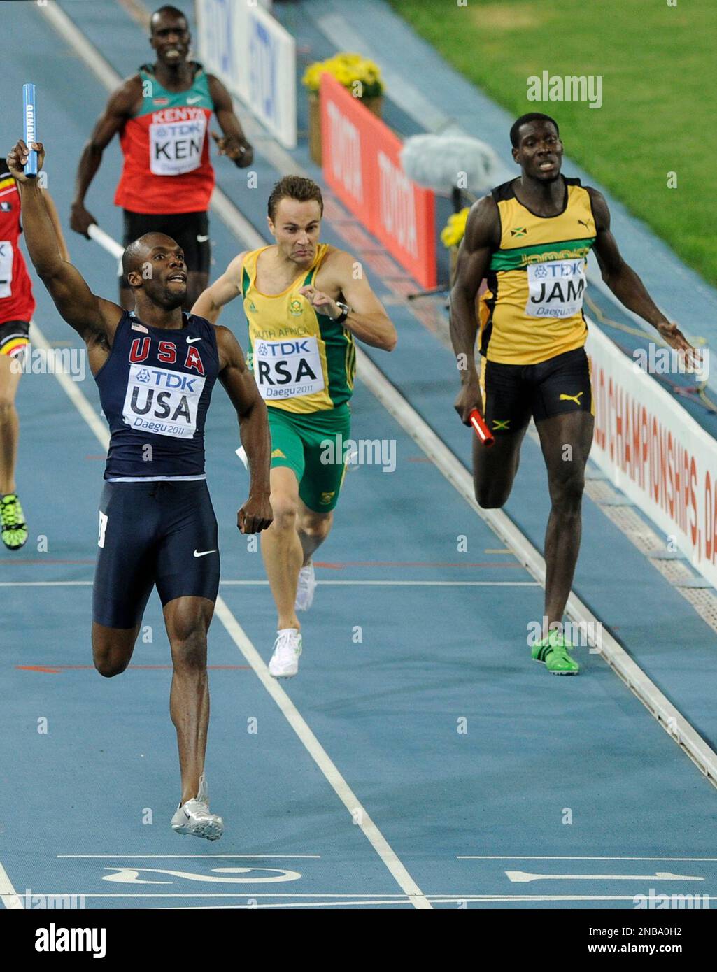 USA's LaShawn Merritt, left, crosses the finish line ahead of South ...