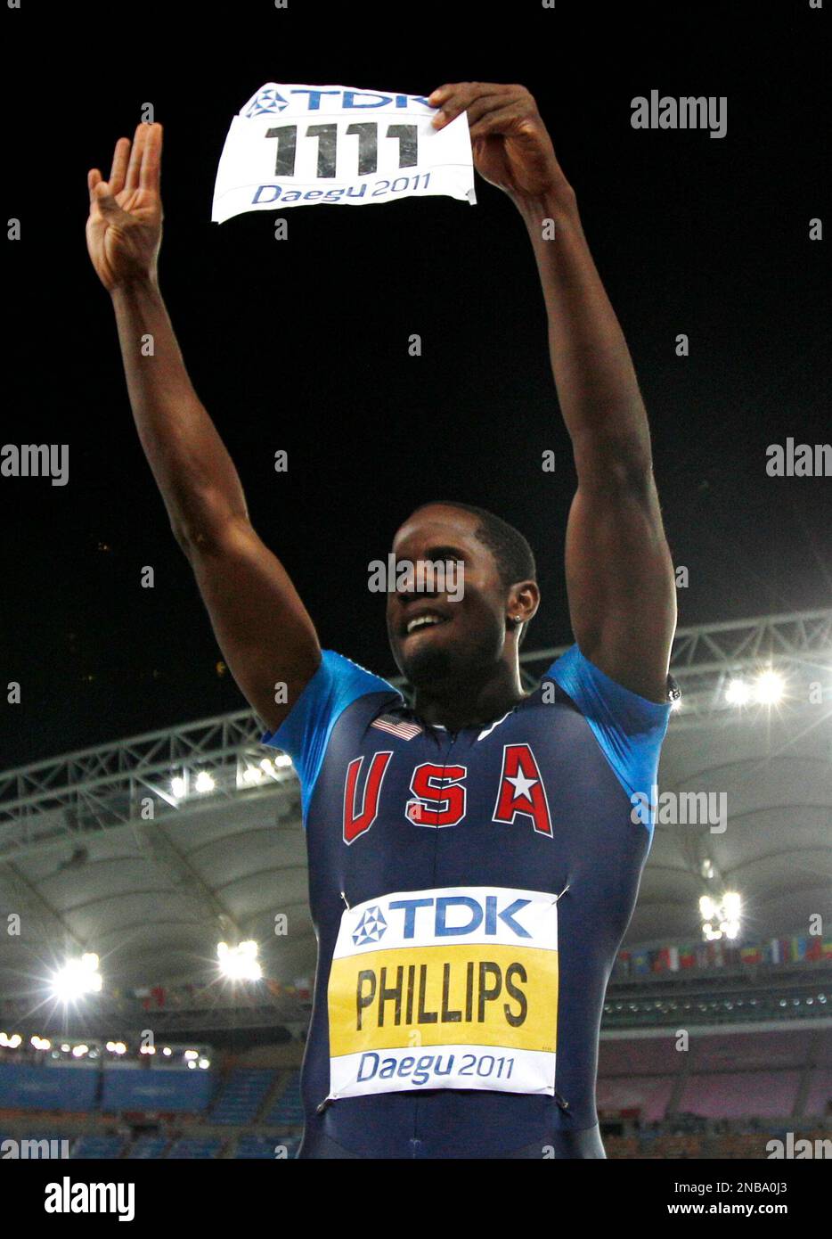 USA's Dwight Phillips celebrates after winning the gold medal in the ...