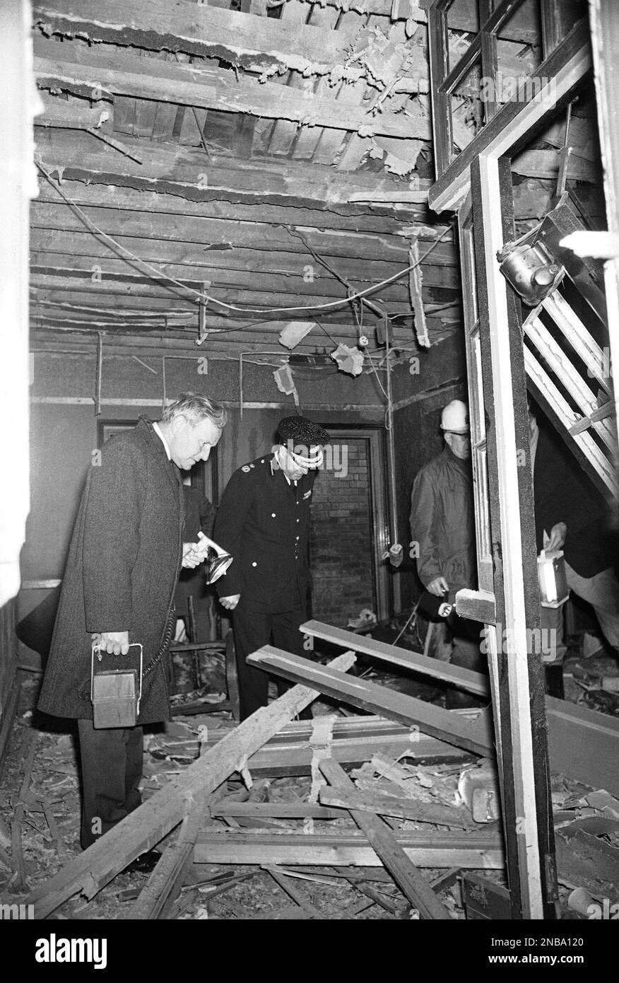 Senior police officers of London’s Bomb Squad examine wreckage of the ...