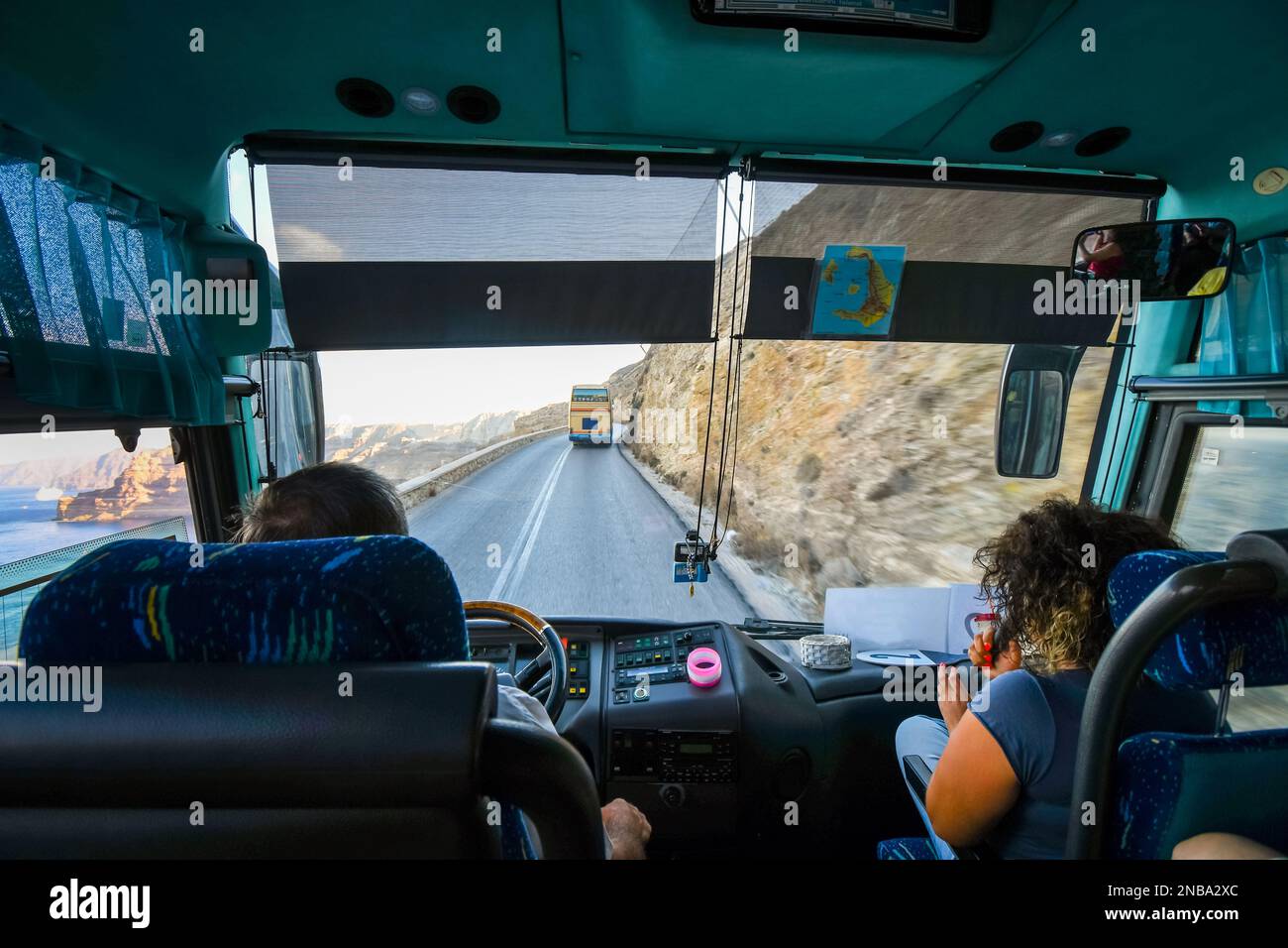 The view from inside a tour bus along the winding hillside road from ...