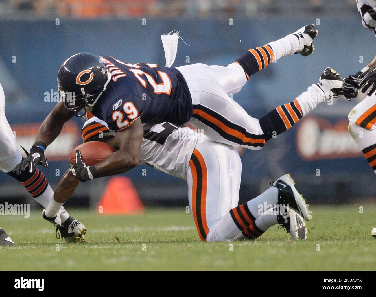 Chicago Bears running back Chester Taylor (29) is tackled by Cleveland ...