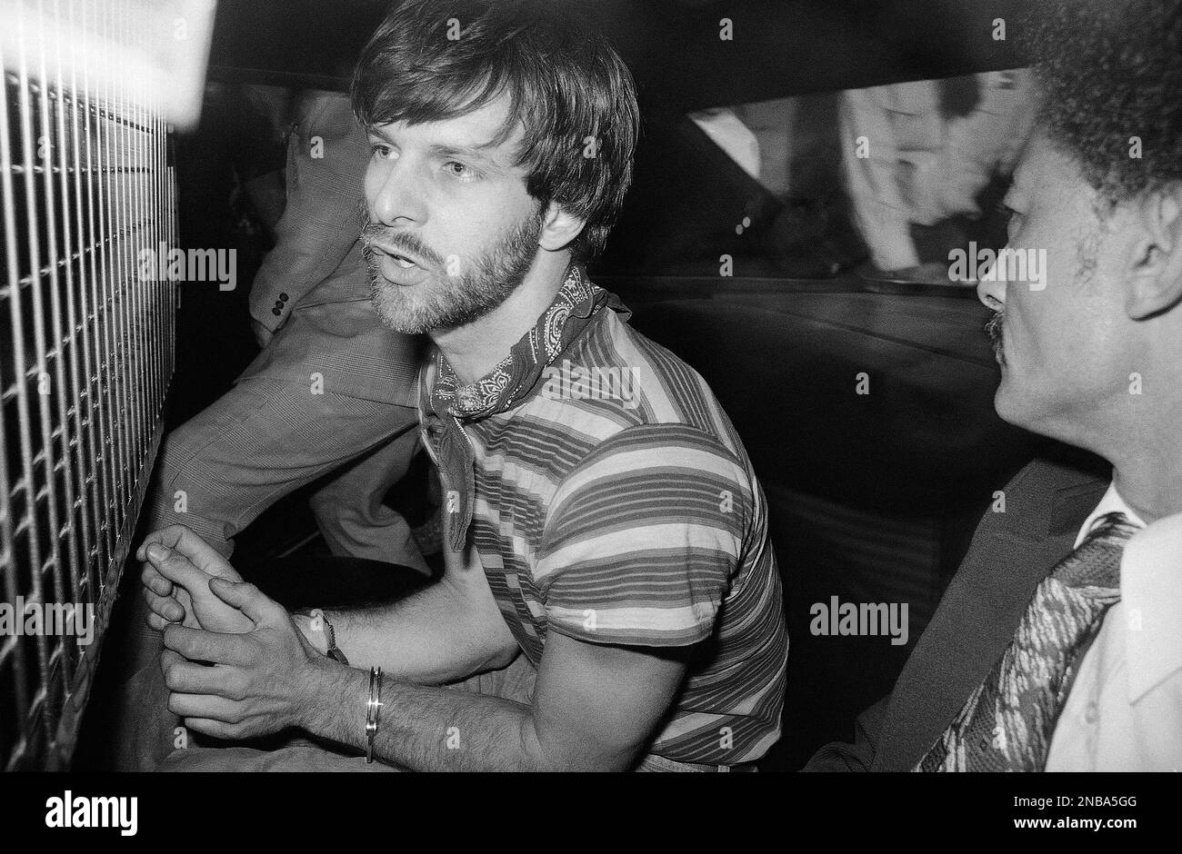 Daredevil aerialist George Willig sits in the back of a police car ...