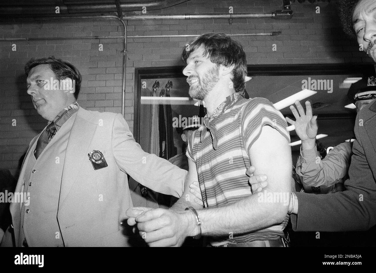 Daredevil aerialist George Willig is escorted in handcuffs by ...