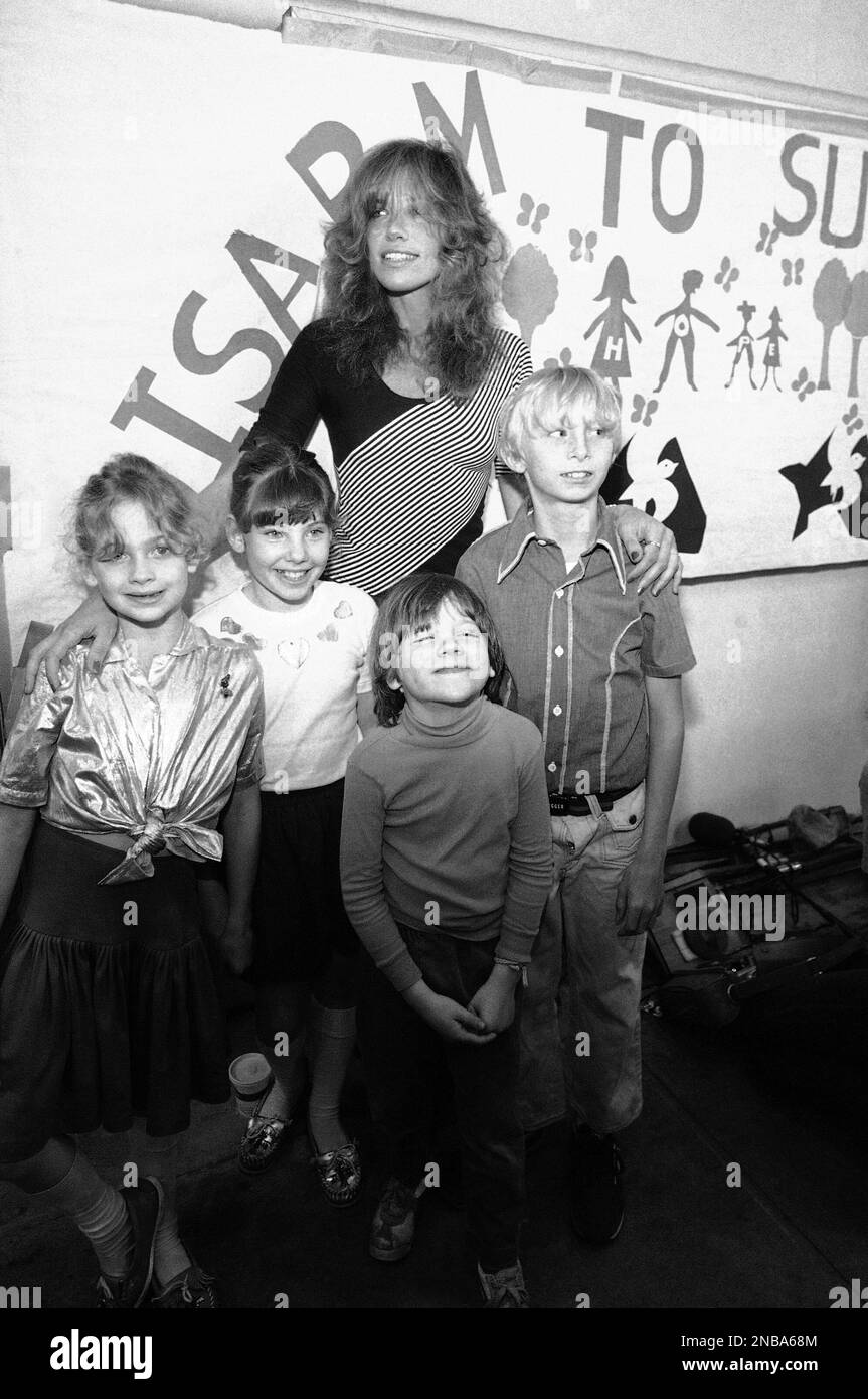 Carly Simon poses with a Street Theatre Group on the theme of nuclear ...