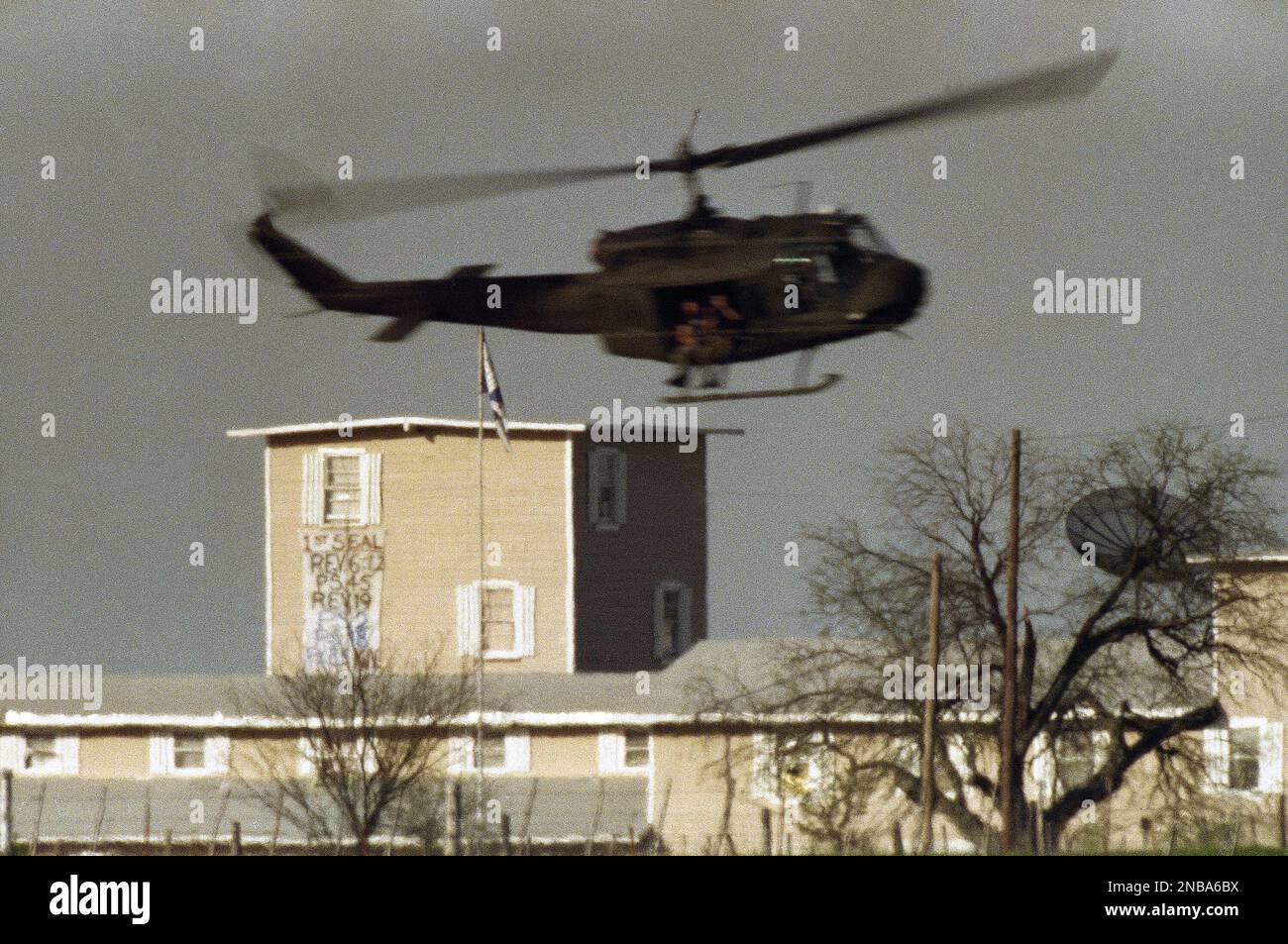 A helicopter makes a low pass over a banner that was unfurled from a ...