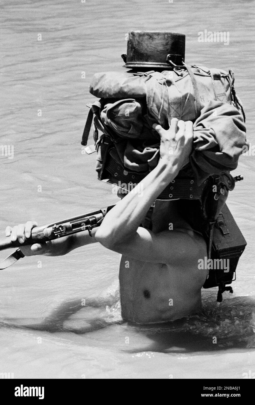 Vietnamese soldier carries his pack, rifle, ammo, uniform, and cooking ...