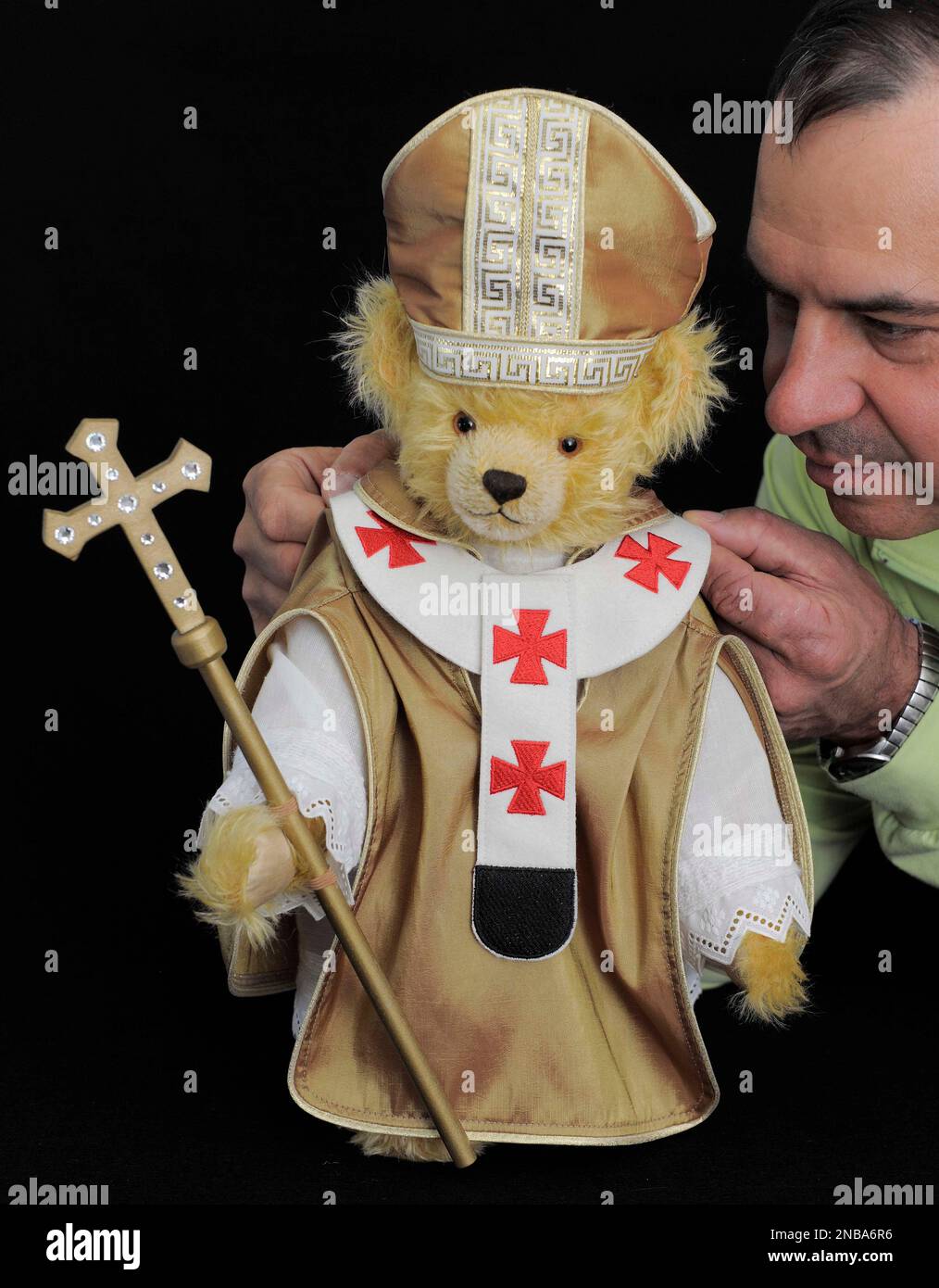 Martin-J. Hermann decorates the 'Pope Benedict XVI Teddy bear' in a ...