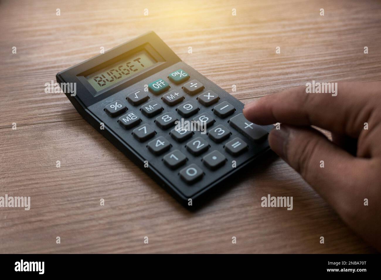 Business and finance concept. Finger press calculator button with word ...