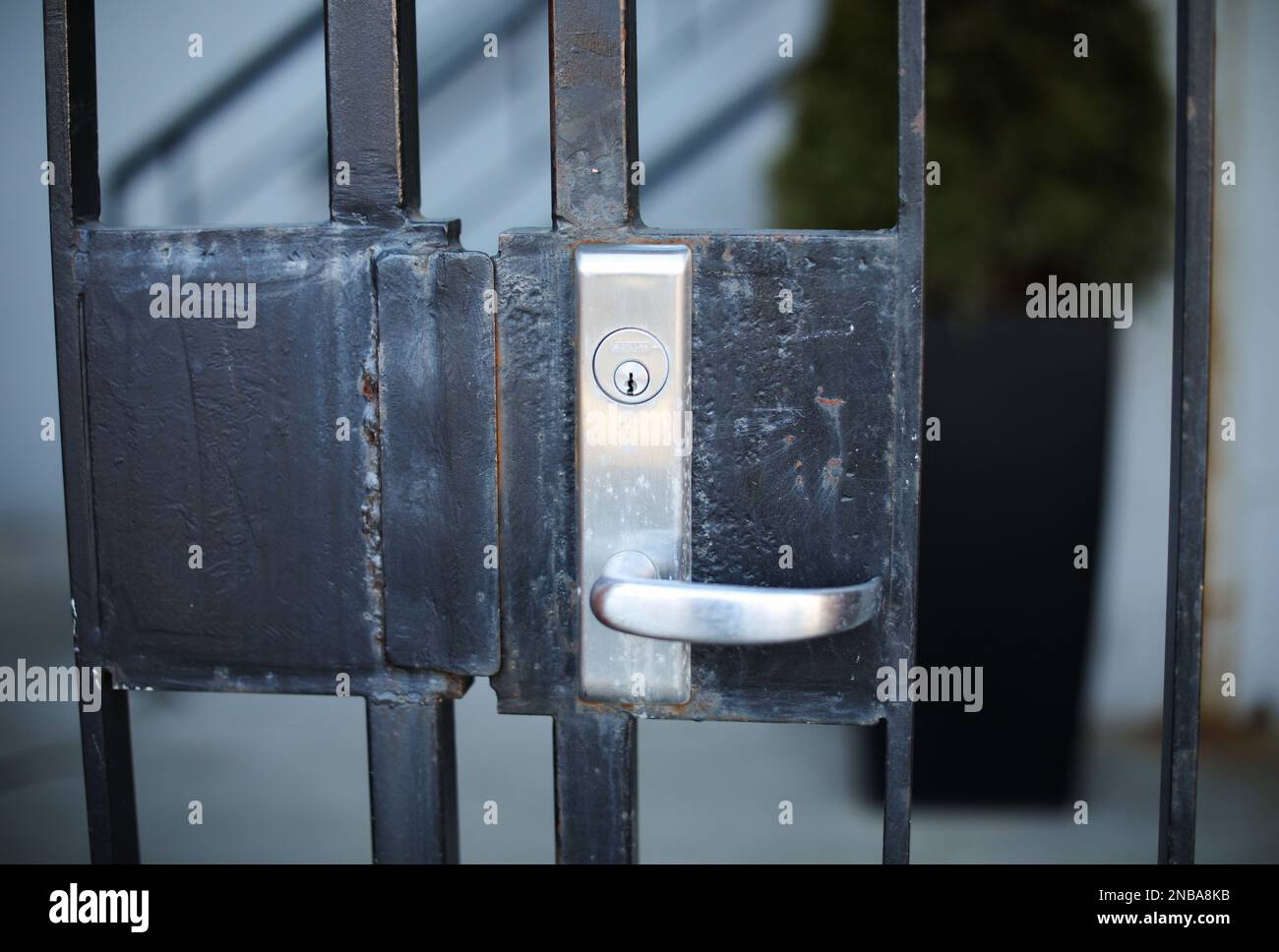 modern metal Door handle and keyhole doorknob Stock Photo - Alamy
