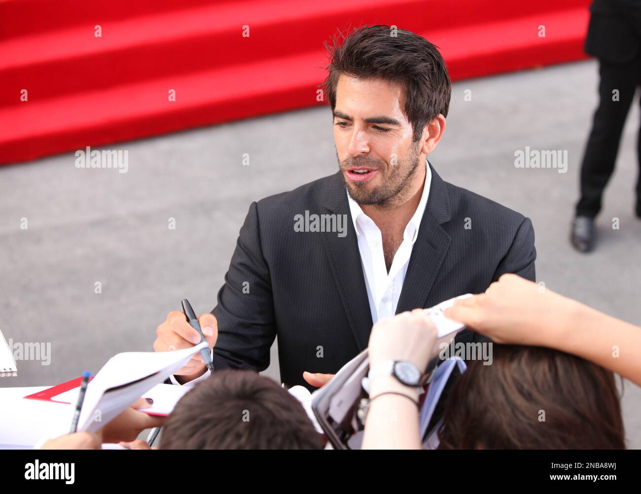 Eli Roth signs autographs for fans at the movie 'The Ides of March ...