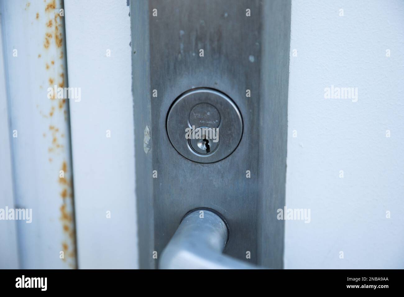 modern metal Door handle and keyhole doorknob Stock Photo - Alamy