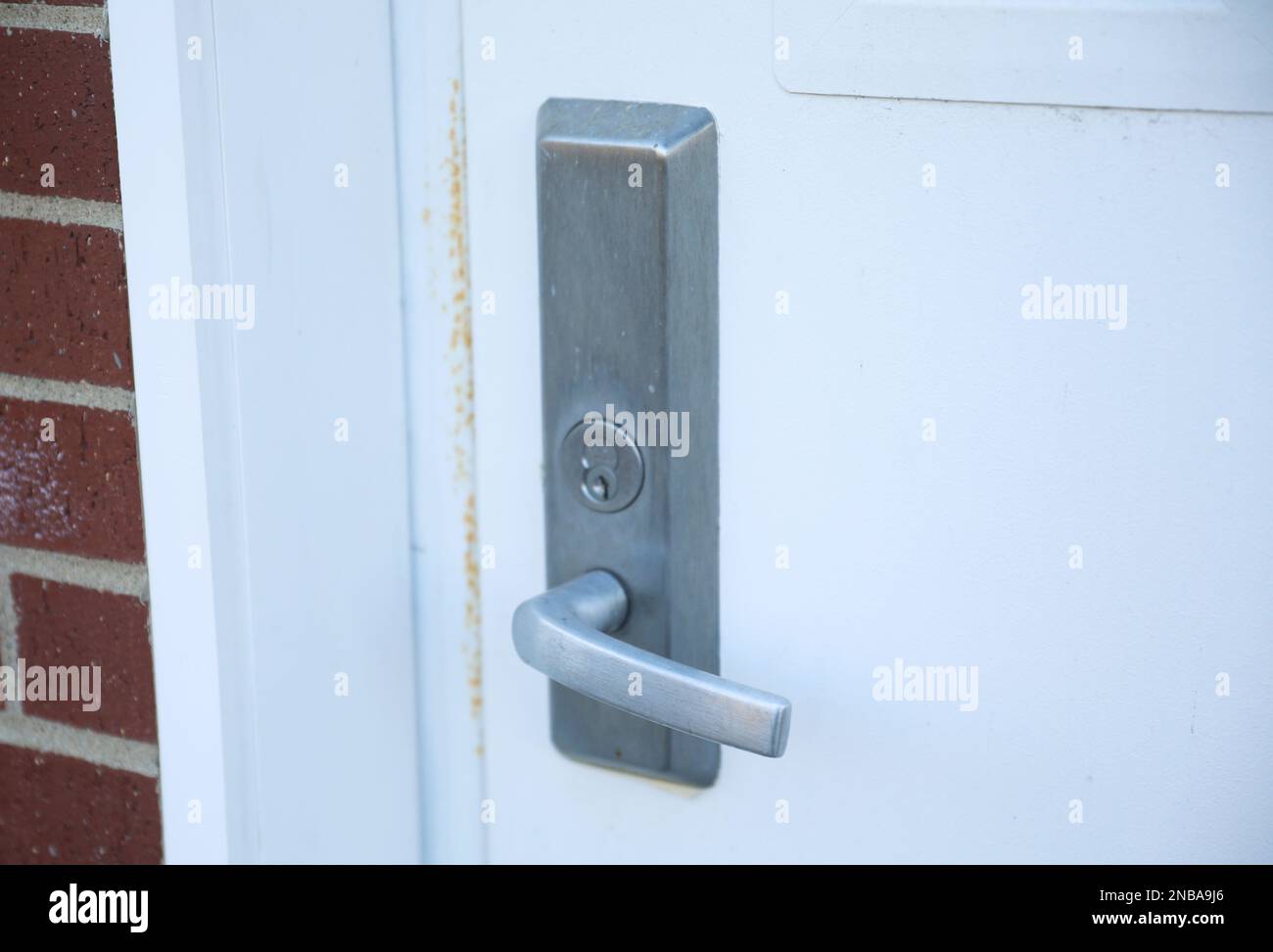 modern metal Door handle and keyhole doorknob Stock Photo - Alamy