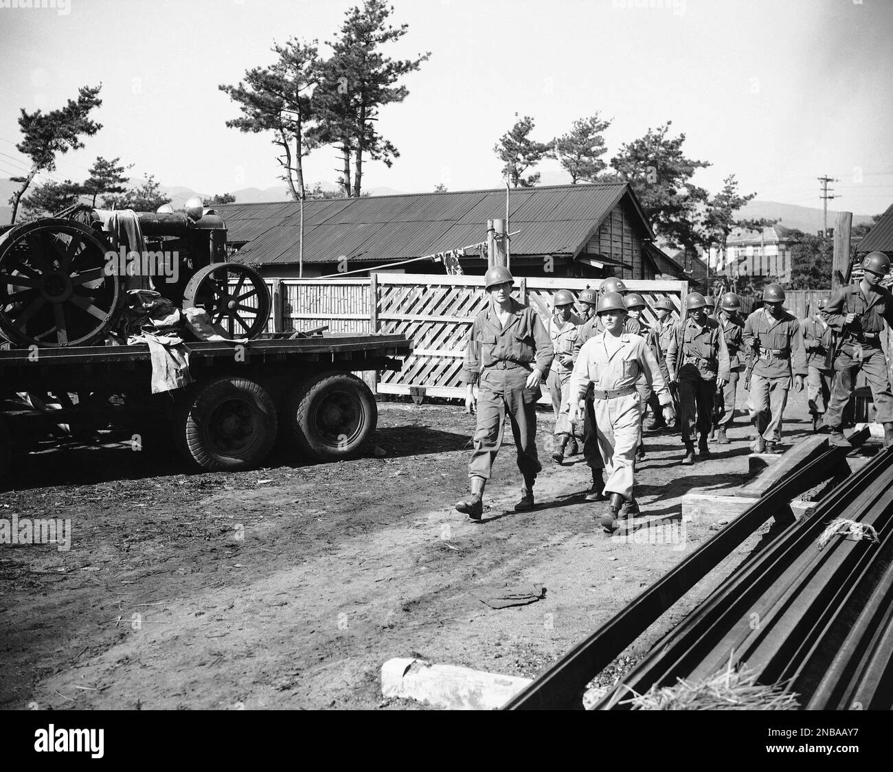 Patrol enters a junk yard and spreads out to search in Japan on Oct. 19 ...