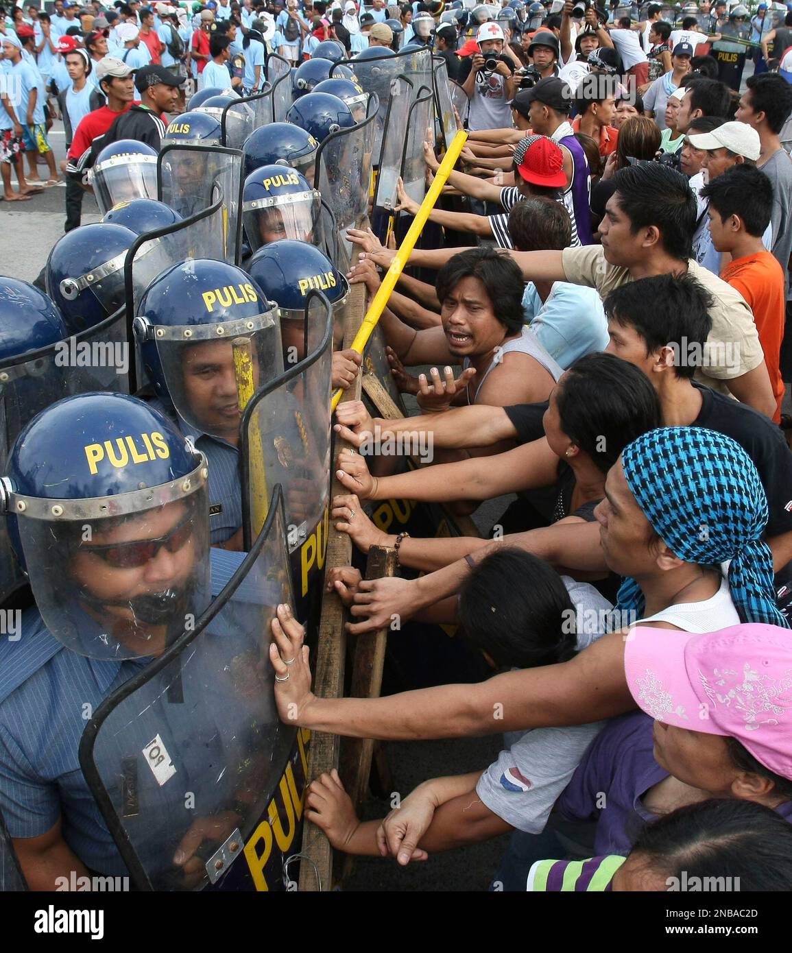 Informal settlers push back riot police as they try to prevent ...