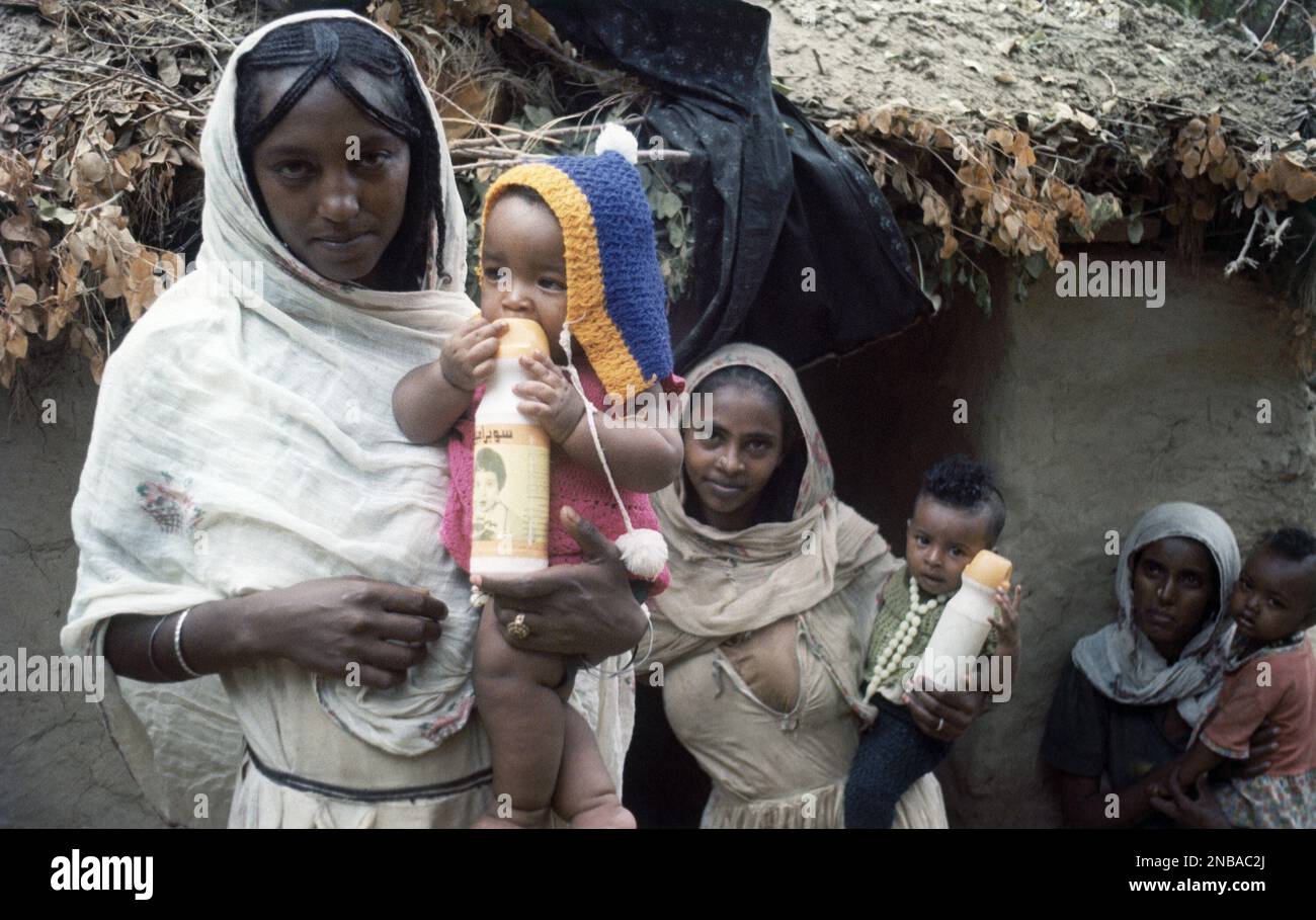 Women and babies at a camp near Nafra, Ethiopia after fleeing from ...