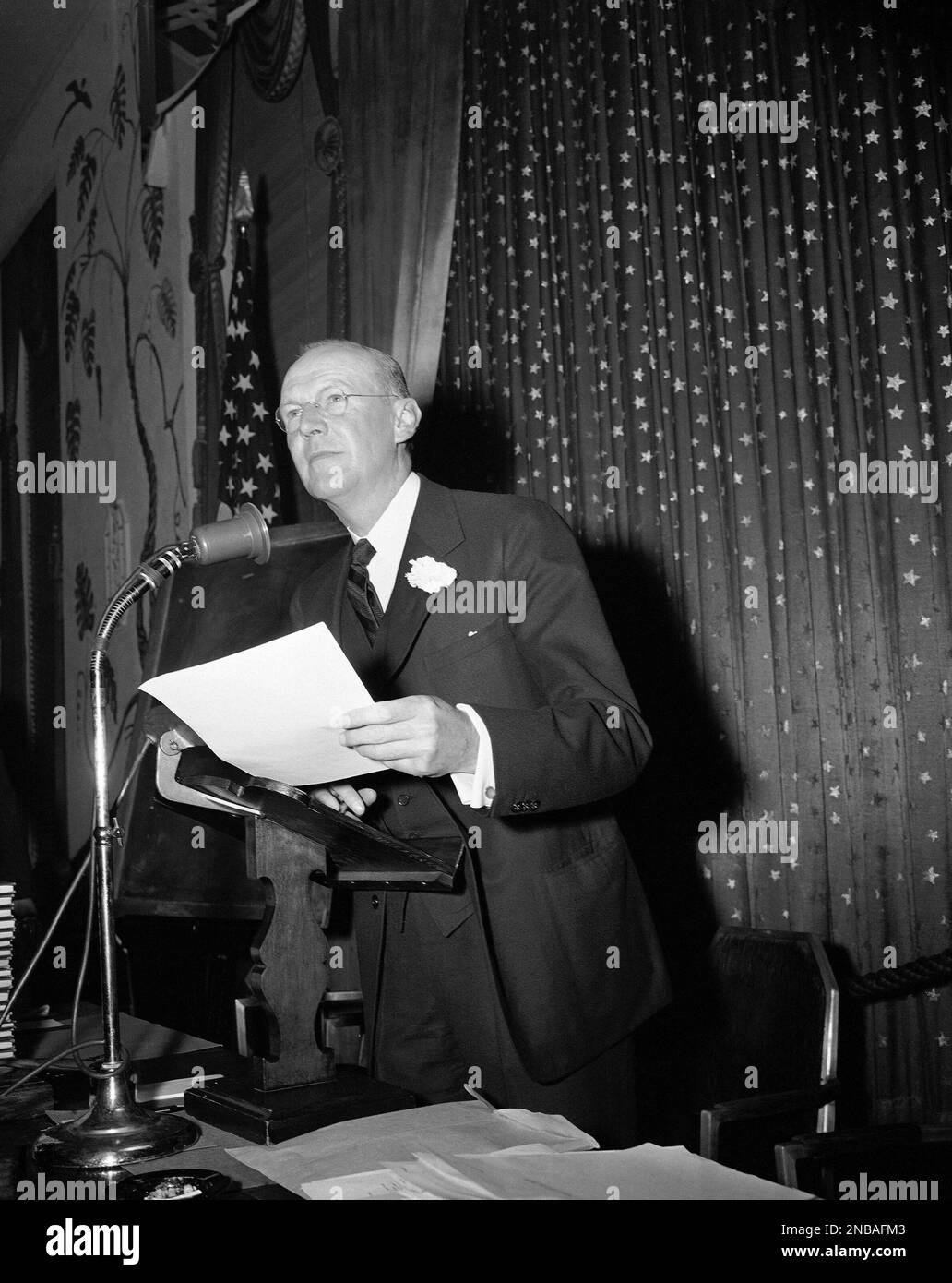 Robert McLean, president of the Associated Press, opens the meeting at ...