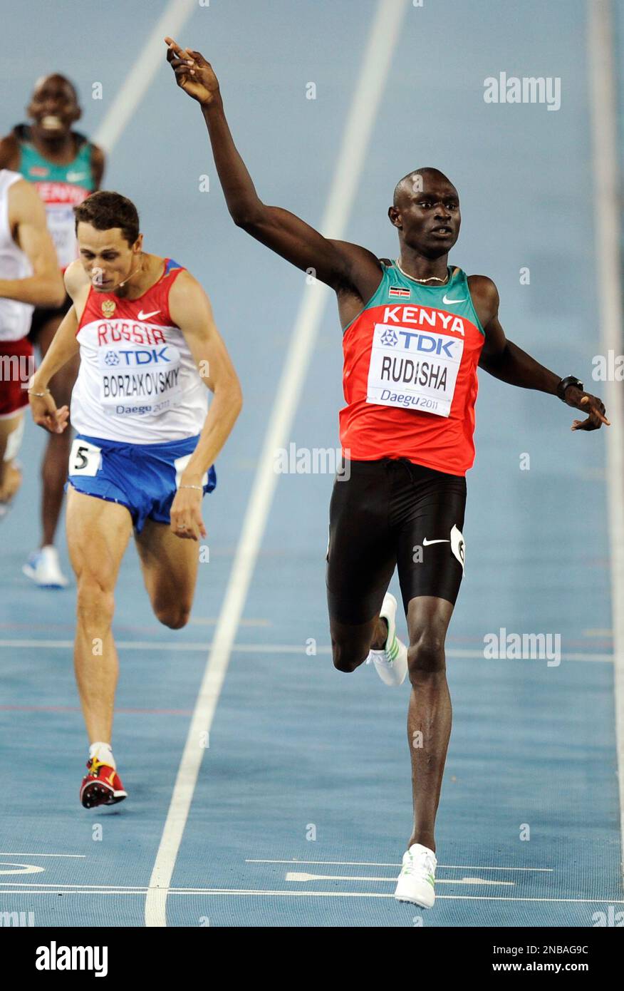 Kenya's David Lekuta Rudisha, right, reacts as he crosses the finish ...