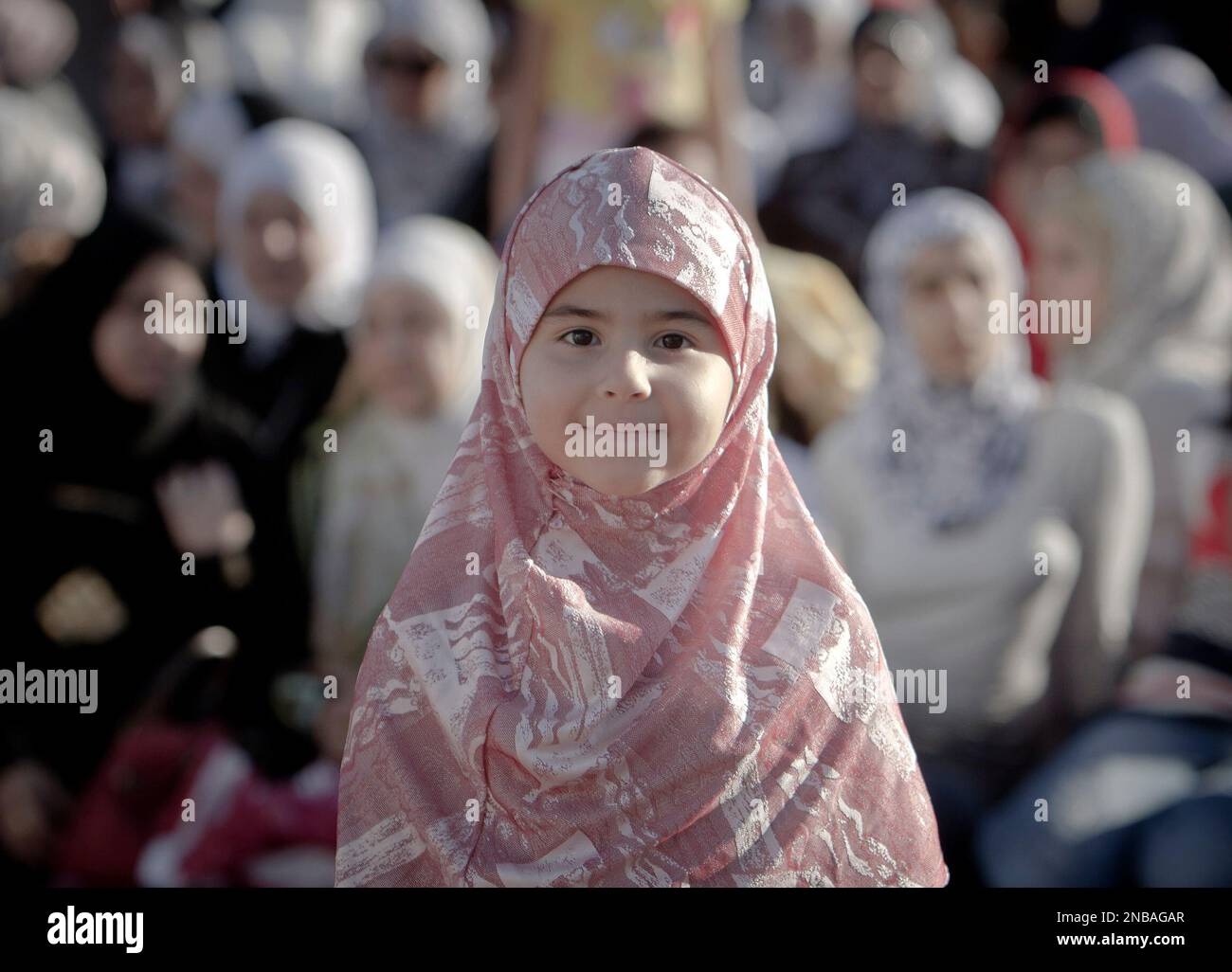 Miri, a 6 year old Muslim girl, poses for a picture after Eid al-Fitr ...
