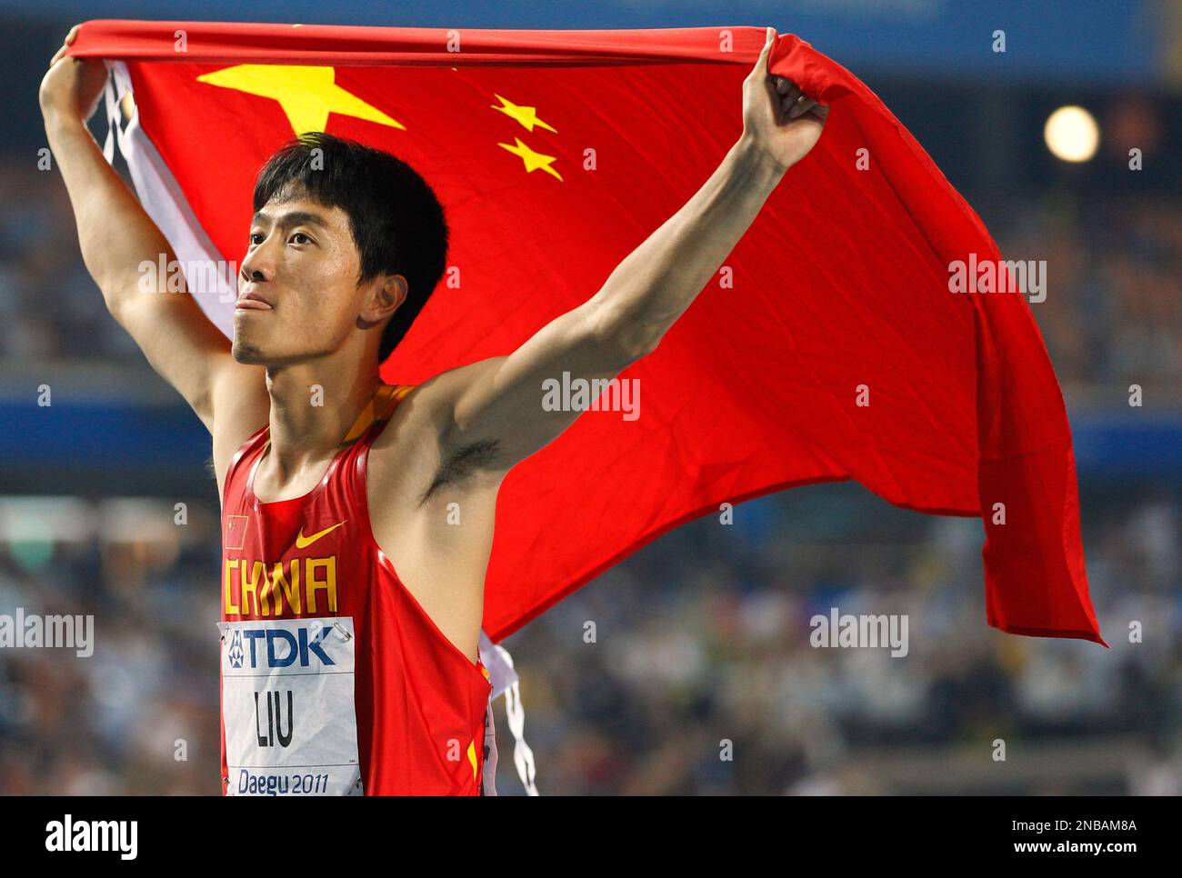 China's Liu Xiang reacts after the Men's 110m Hurdles final at the ...