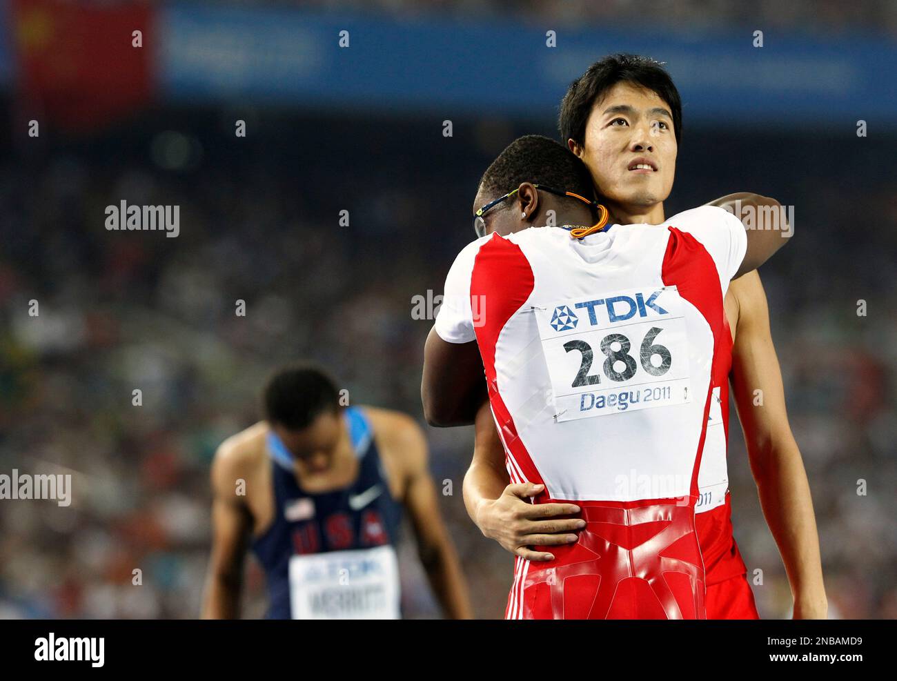 Cuba's Dayron Robles, left, embraces bronze medalist Liu Xiang of China ...