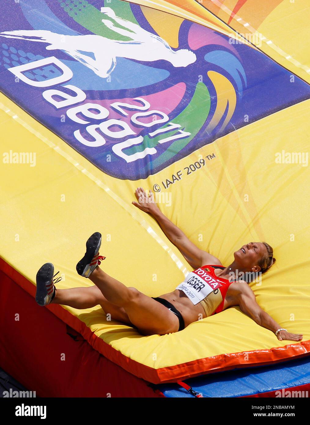 Germany's Jennifer Oeser lands on the mat as she competes in the ...