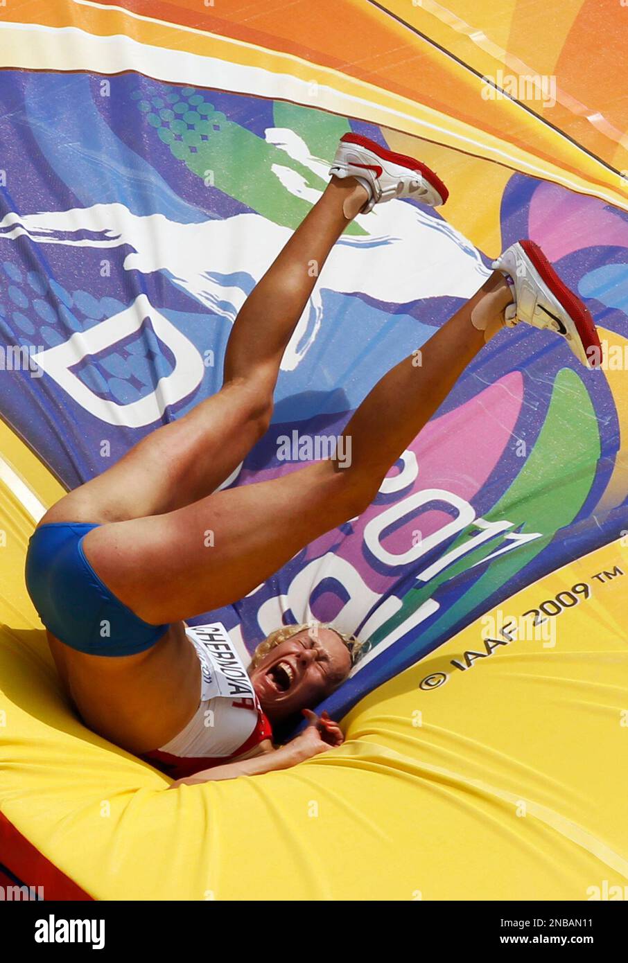 Russia's Tatyana Chernova celebrates as she clears the bar in the ...