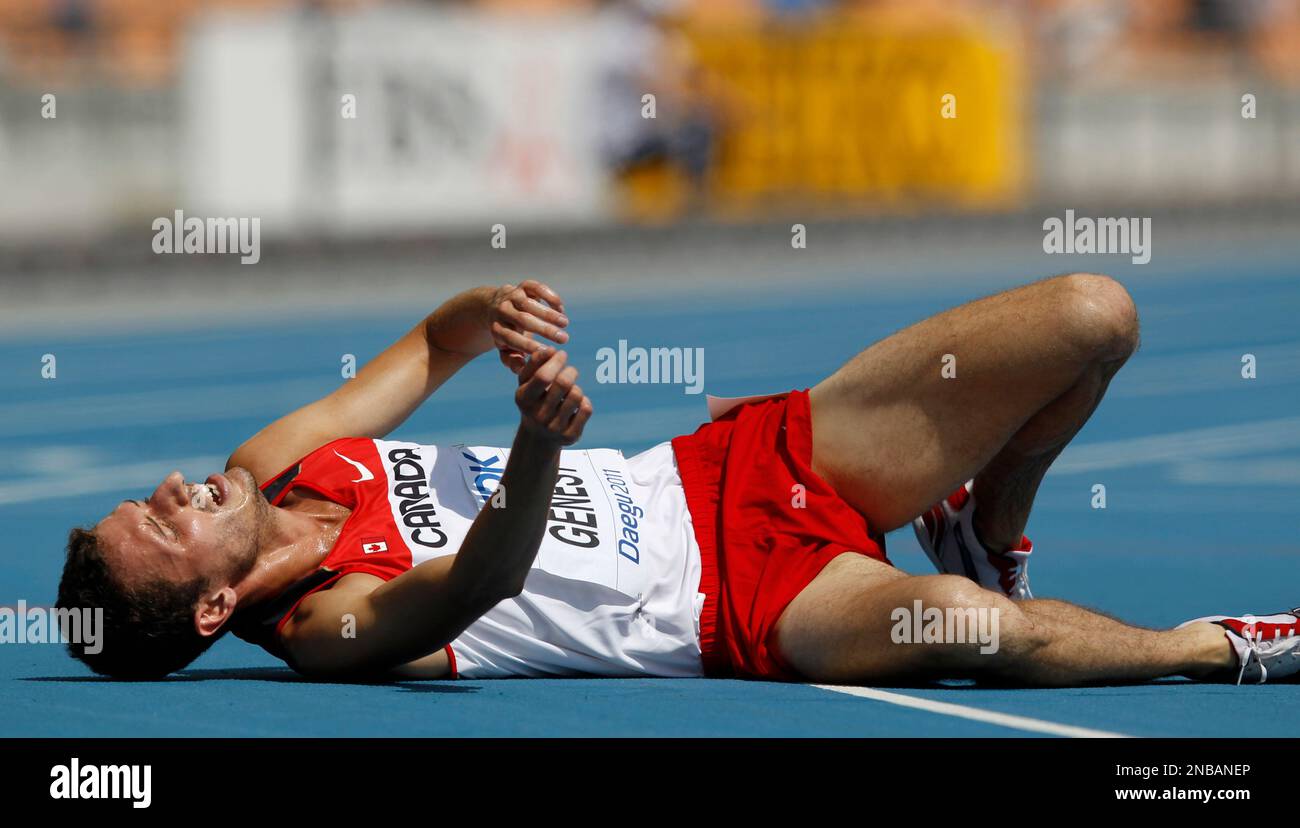 Canada's Alex Genest lies on the track following a heat of the Men's ...