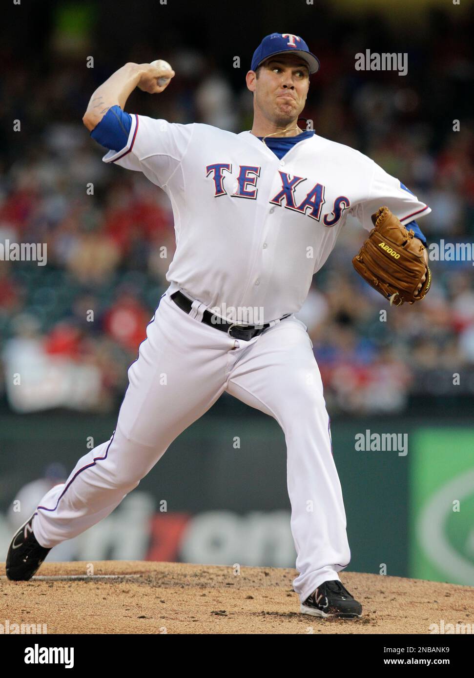 Texas Rangers starting pitcher Colby Lewis (48) delivers to the Los ...
