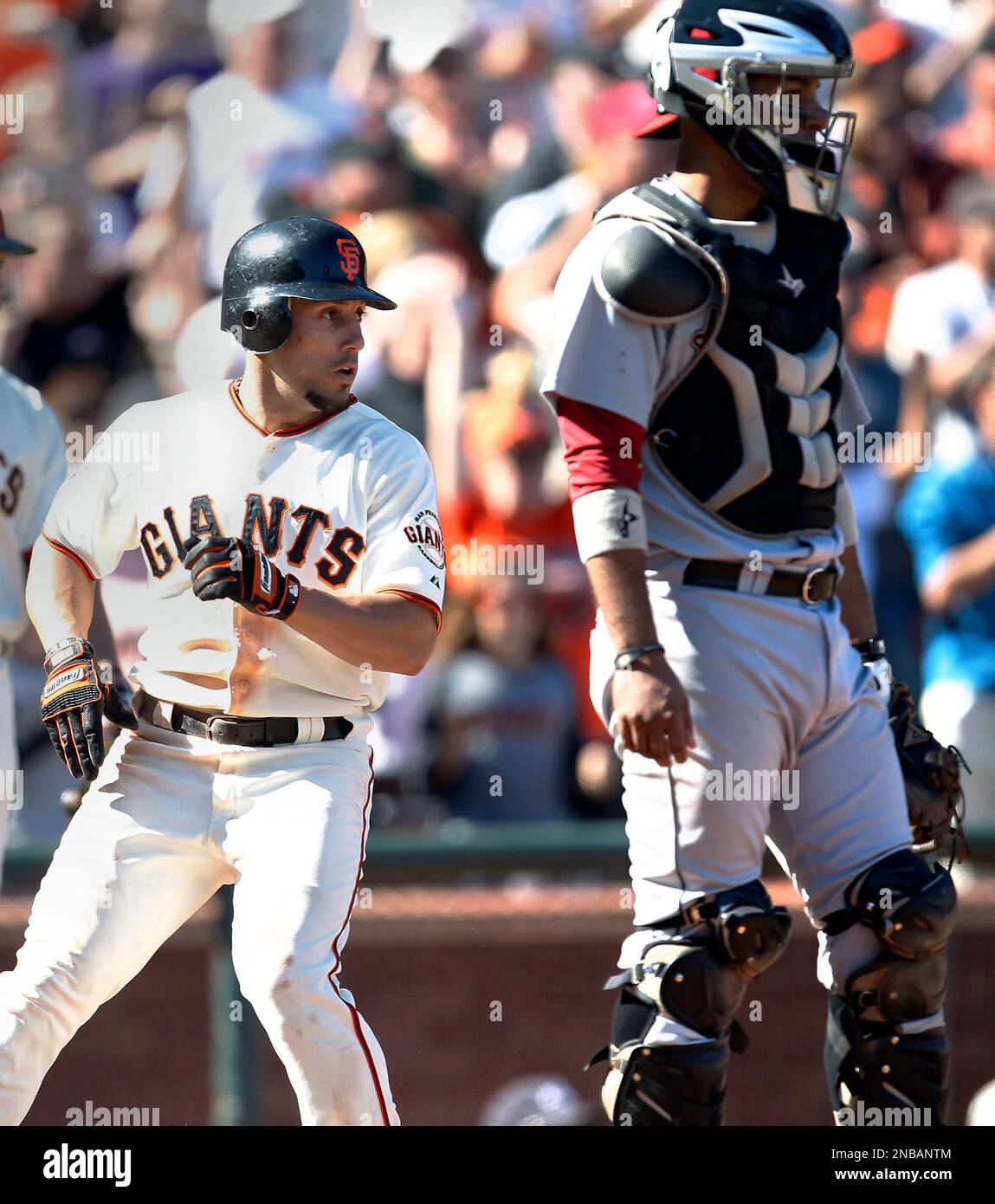 San Francisco Giants' Andres Torres, left, scores a run past Houston ...