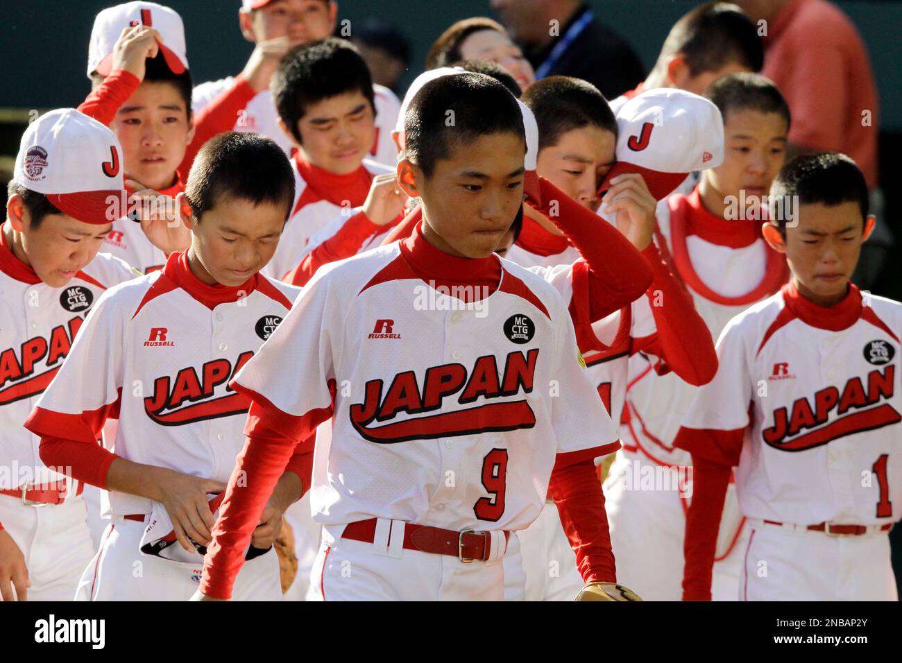 The Hamamatsu City, Japan, Little League team walks to their dugout ...