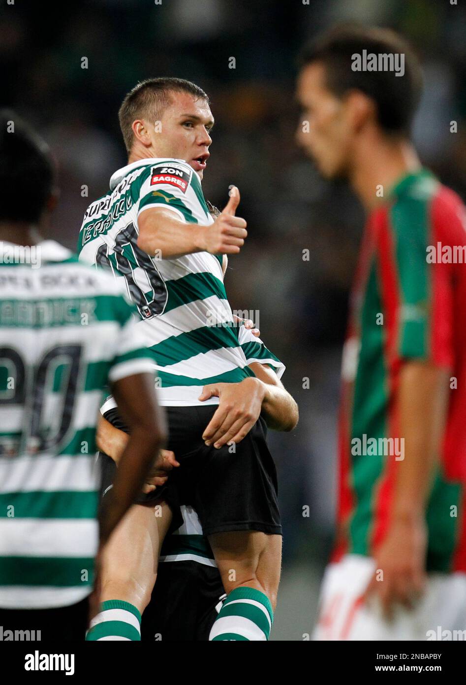 Sporting's Marat Izmailov, from Russia, center, reacts after scoring ...