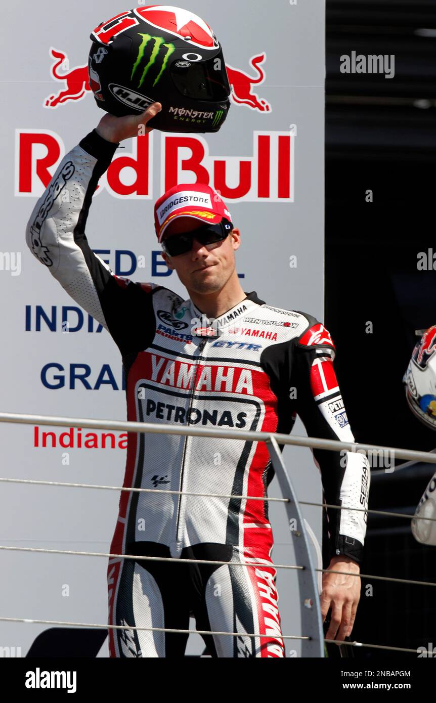 Ben Spies waves to fans as he comes to the podium after finishing third ...