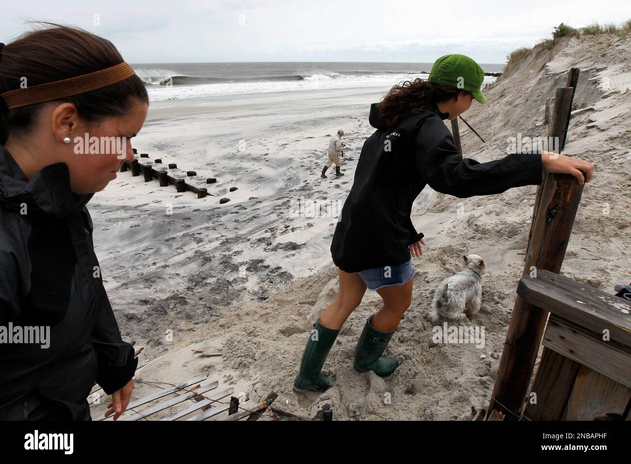 Mary Kate Kelly, left, with her sister Jackie Kelly, climb down the ...