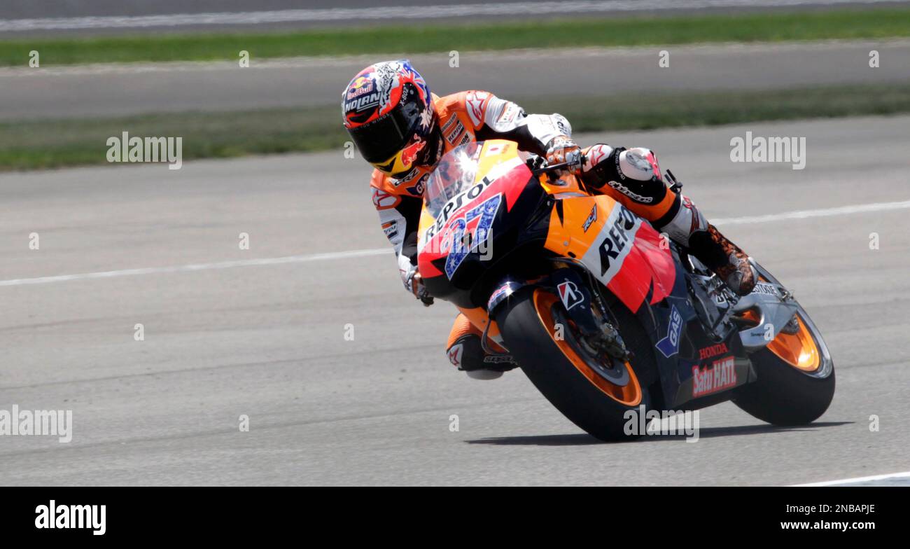 Casey Stoner, of Australia, rides his Honda early in the race at the ...