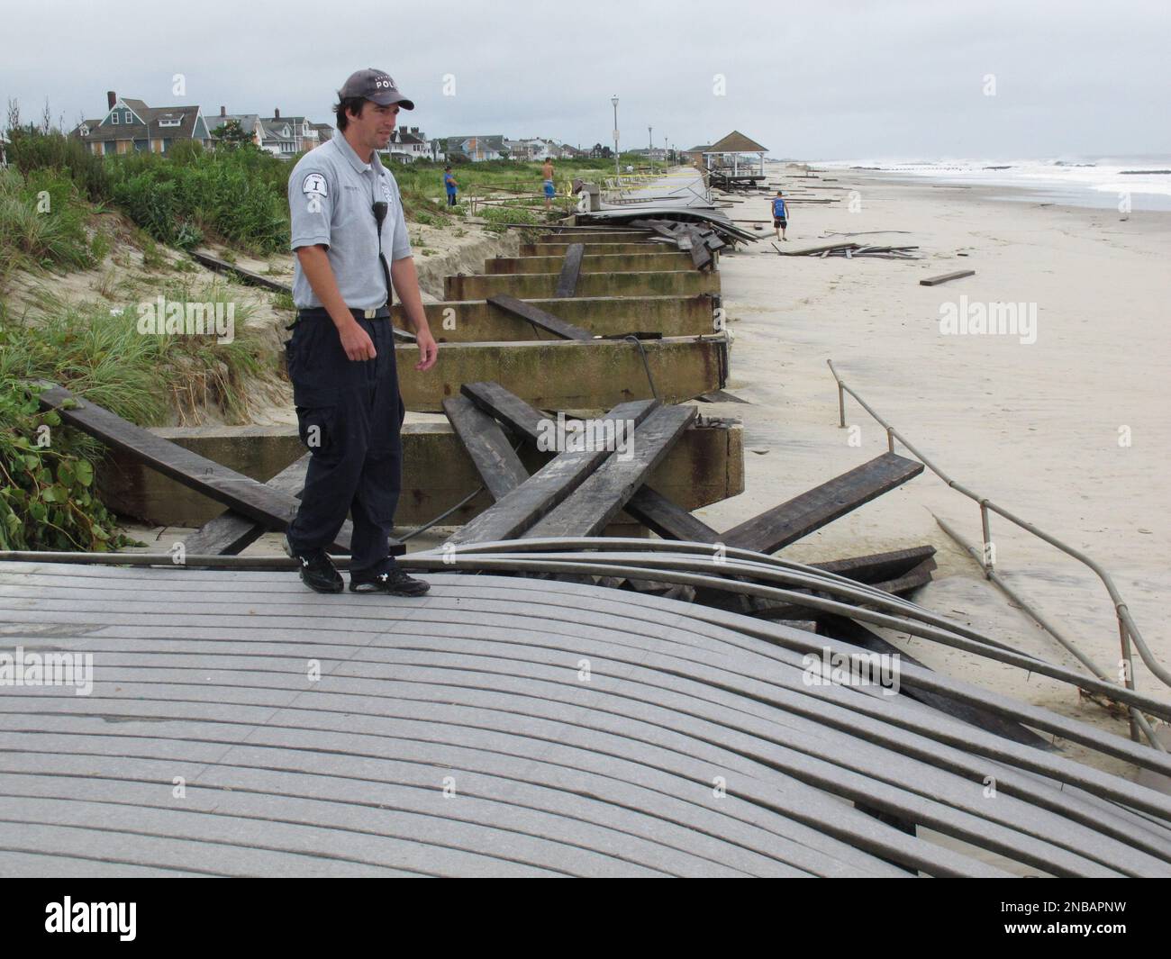 Special Police Officer Kevin Preston inspects a damaged section of ...