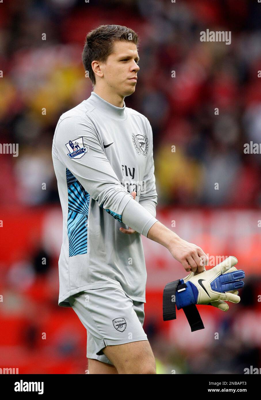 Arsenal goalkeeper Wojciech Szczesny leaves the pitch after losing to ...