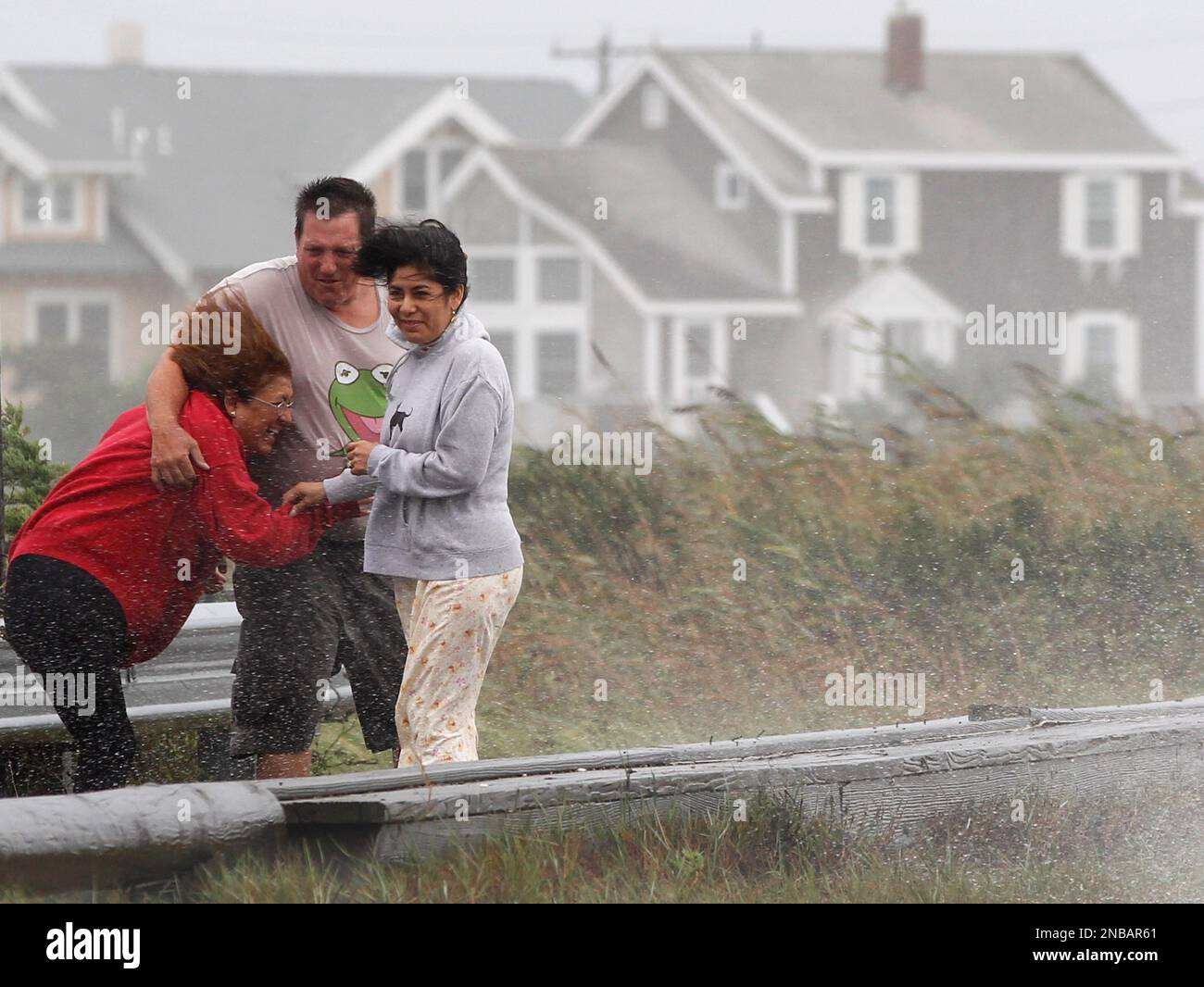 Peter Monaco, of Dunstable, Mass., center, and two unidentified women ...