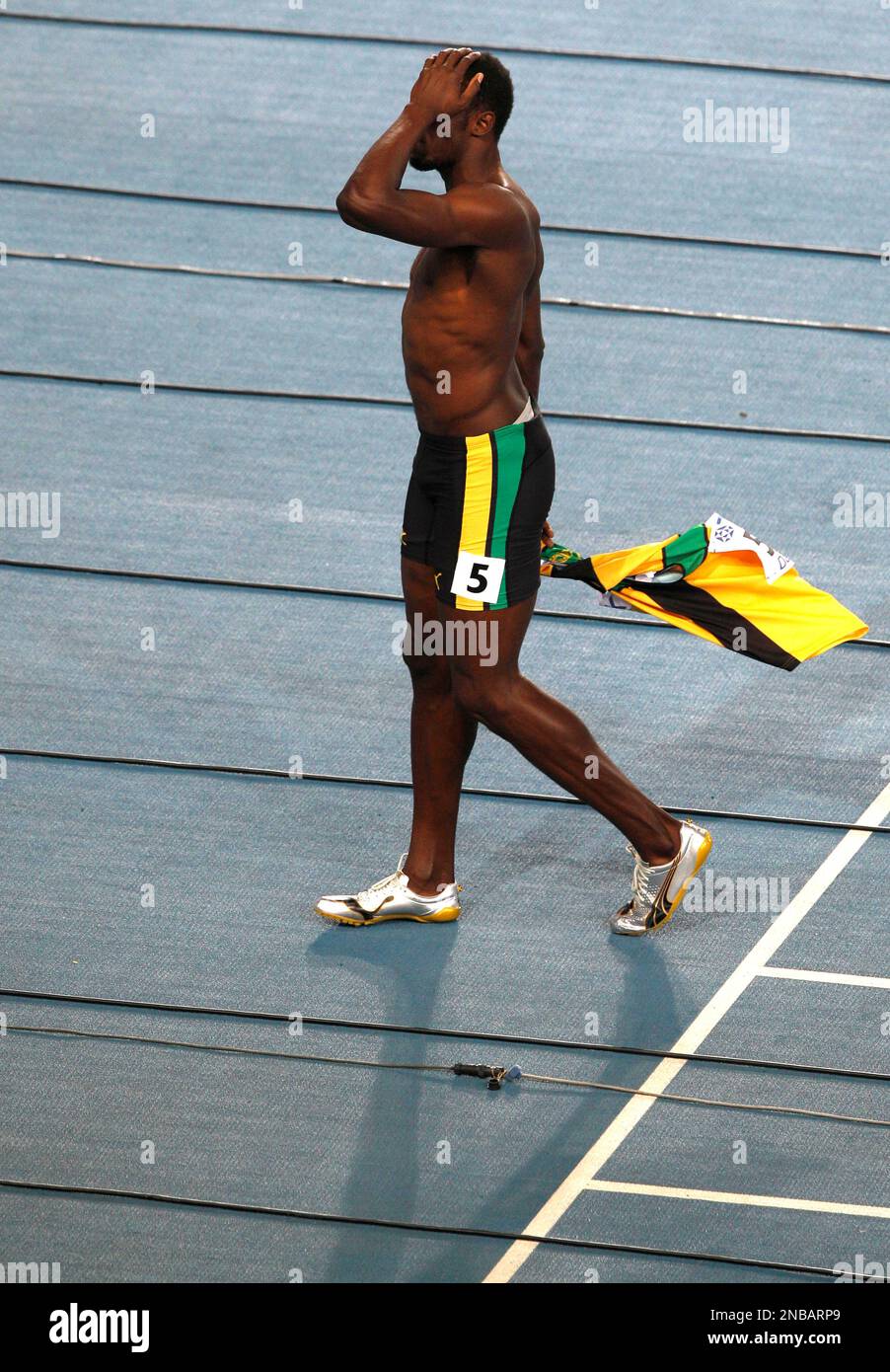 Jamaica's Usain Bolt reacts after being disqualified due to a false ...