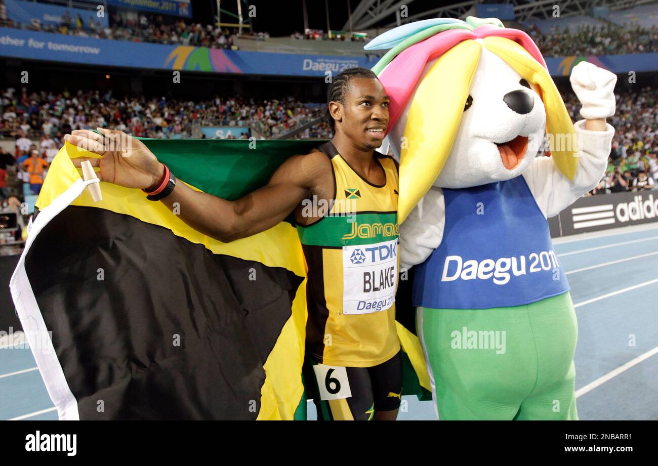 Jamaica's Yohan Blake poses with mascot Sapsal-gae after winning Men's ...