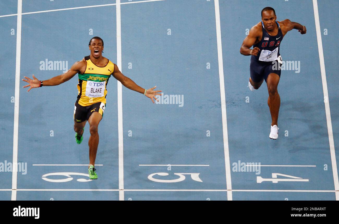 Jamaica's Yohan Blake, left, crosses the finish line to win gold ahead ...