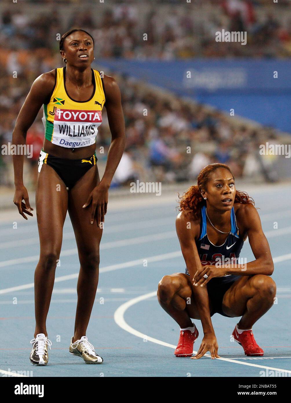 Jamaica's Shericka Williams, left, and USA's Sanya Richards-Ross look ...