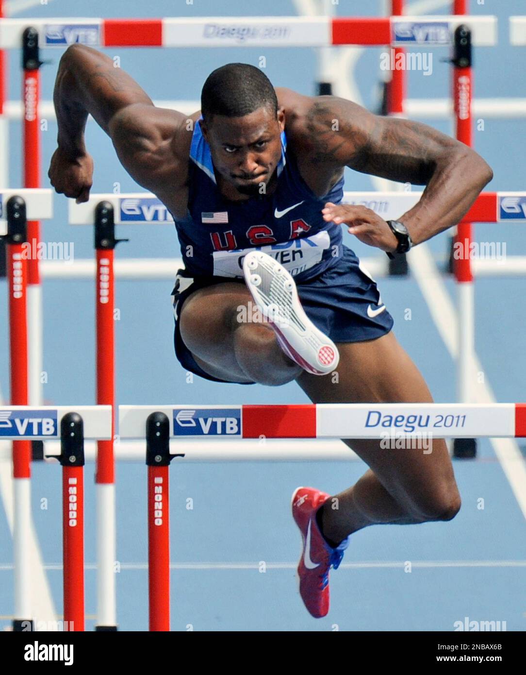 USA's David Oliver competes in a heat of the 110m Hurdles at the World ...