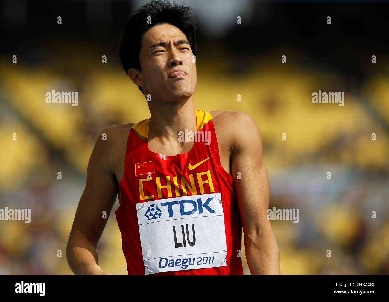 China's Xiang Liu reacts after competing in a heat of the Men's 110m ...