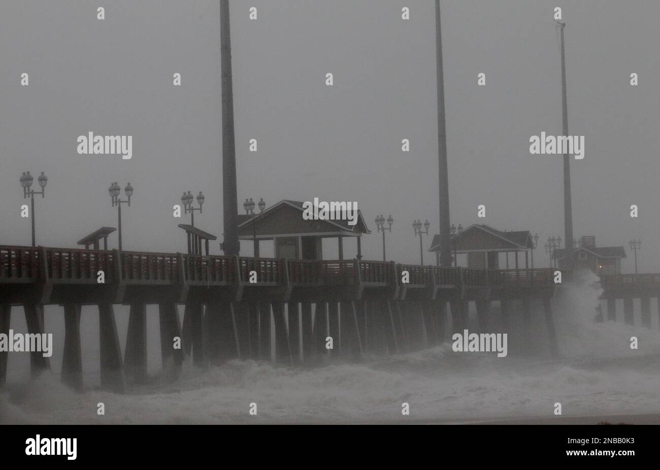Waves crash on Jennette's Pier as the effects of Hurricane Irene are ...